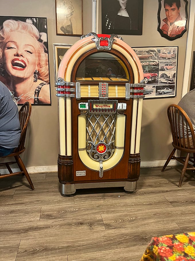 That vintage Wurlitzer jukebox holds court like royalty, ready to soundtrack your meal with classic American tunes.