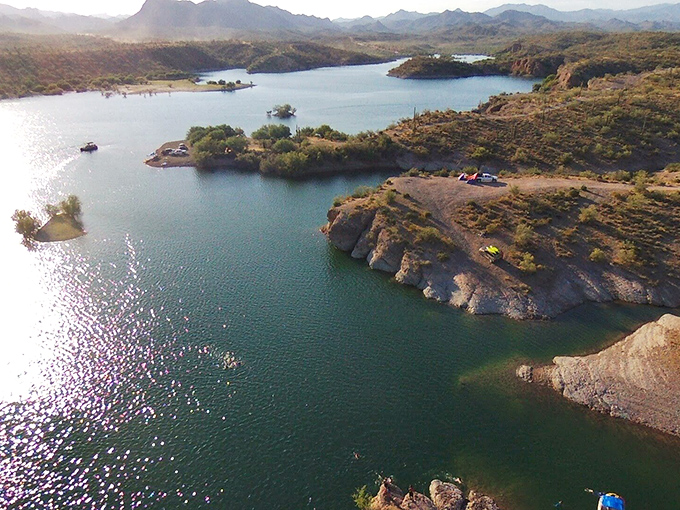 Nature's jigsaw puzzle of land and water. This aerial perspective reveals Lake Pleasant's intricate shoreline and hidden coves waiting to be explored.
