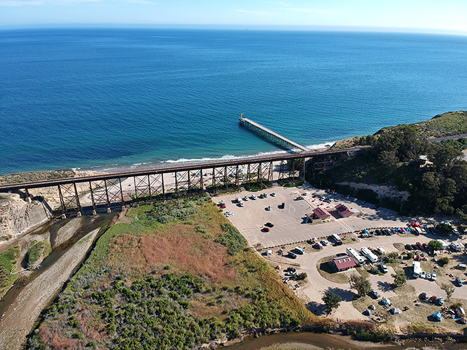 From above, Gaviota reveals its perfect composition &ndash; pier stretching into blue infinity while the trestle frames nature's masterpiece below.