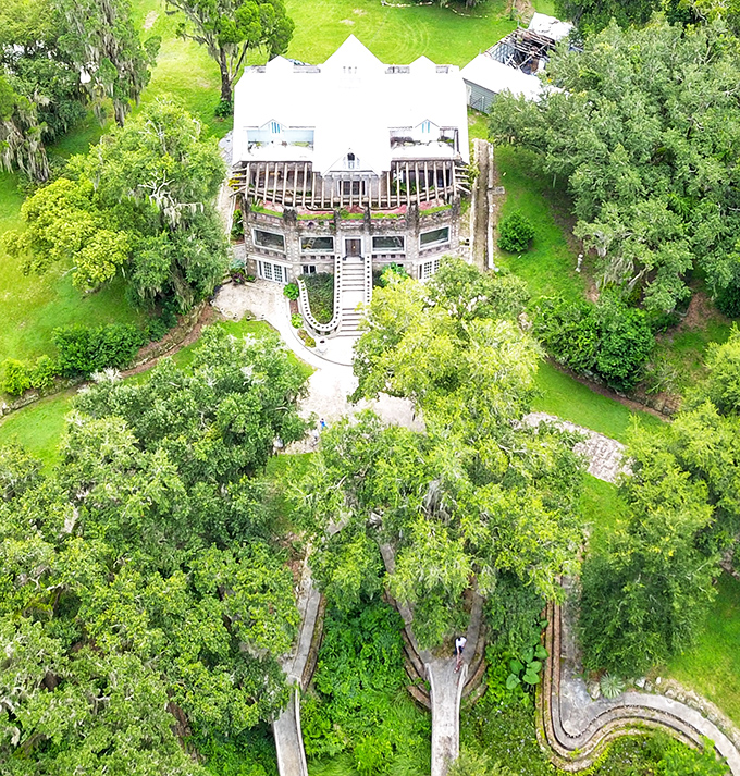 The aerial view reveals Wonder House's perfect symmetry and how the structure harmonizes with its expansive grounds&mdash;architectural poetry from above.