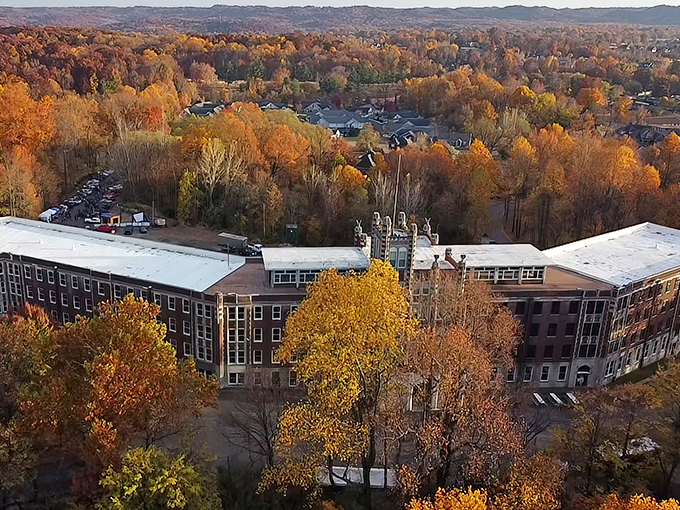 Autumn colors soften Waverly's harsh edges. From above, the massive sanatorium complex reveals its true scale amid Kentucky's fall foliage.