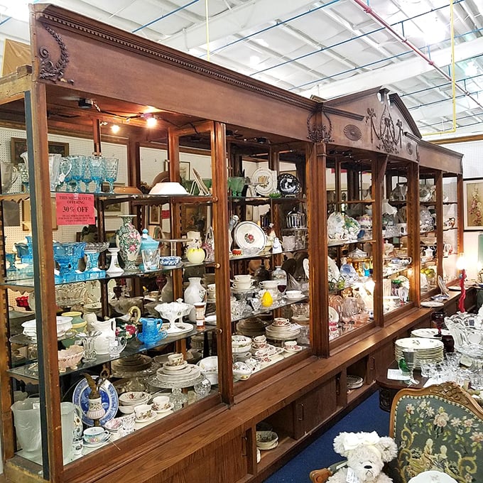 This antique display case doesn't just hold collectibles&mdash;it's a museum-quality time machine showcasing the fine china and crystal that once defined special occasions.