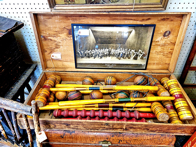 An antique croquet set that's seen more garden parties than you've had hot dinners. Imagine the Victorian trash-talk that accompanied those wooden mallets!