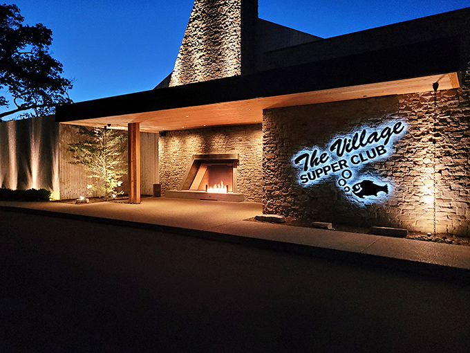 At night, the stone and light create a warm invitation that practically whispers, "Yes, you deserve this splurge tonight."