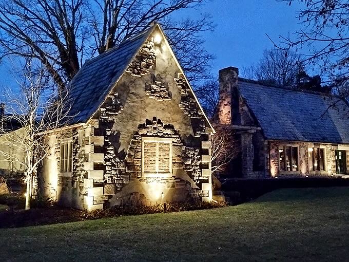 As twilight falls, strategic lighting transforms stone buildings into glowing beacons of warmth against the night sky.