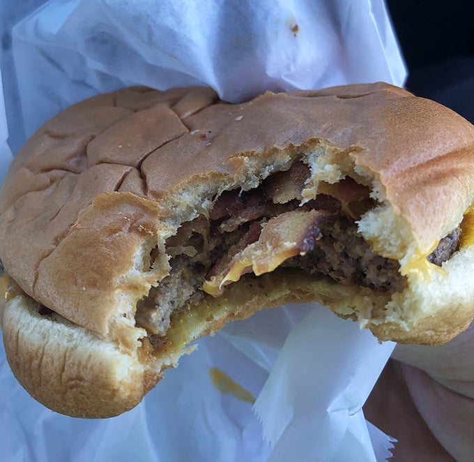 One bite missing because waiting to take a photo was simply impossible. This cheeseburger demands immediate attention.