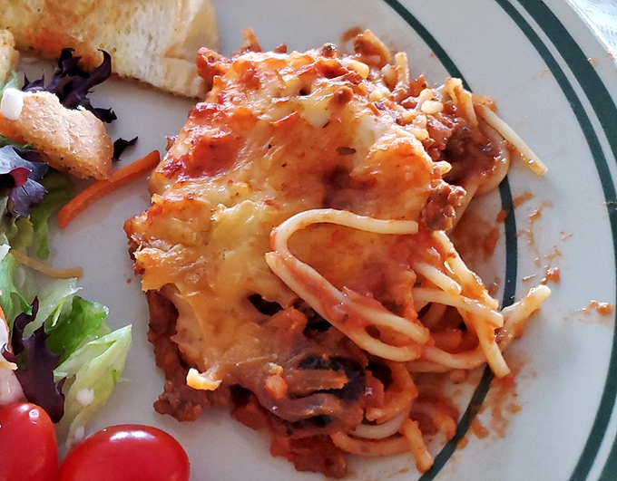 Baked spaghetti that proves pasta doesn't need a fancy Italian passport to win your heart—just cheese, sauce, and Midwestern generosity.