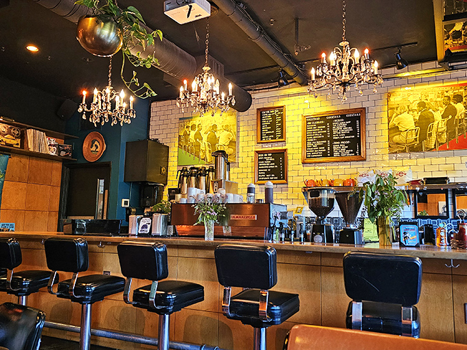 The bar area gleams with possibility under vintage chandeliers&mdash;where coffee transforms into cocktails as the day unfolds.
