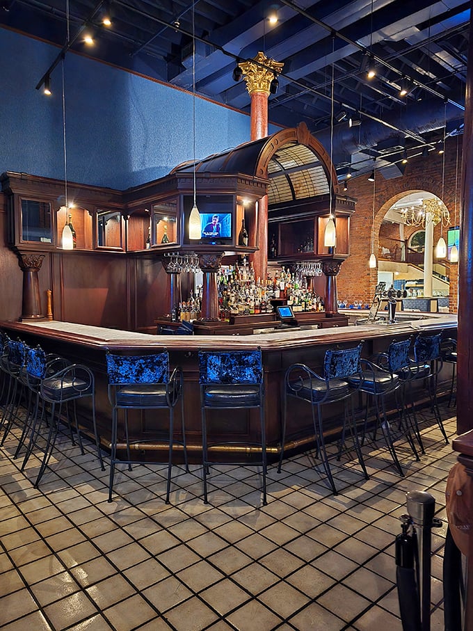 A bar that balances old-world craftsmanship with modern flair. Those blue-lit bar stools have supported countless elbows during "just one more" after-dinner drinks.