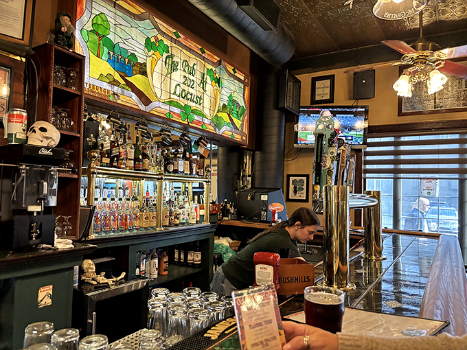 The bar's stained glass backdrop transforms ordinary drinking into a near-religious experience. Even the most basic beer feels blessed here.