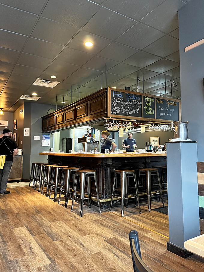 A bar where strangers become friends over oysters and wine. The chalkboard menu promises treasures from the deep, while the staff delivers on that promise.