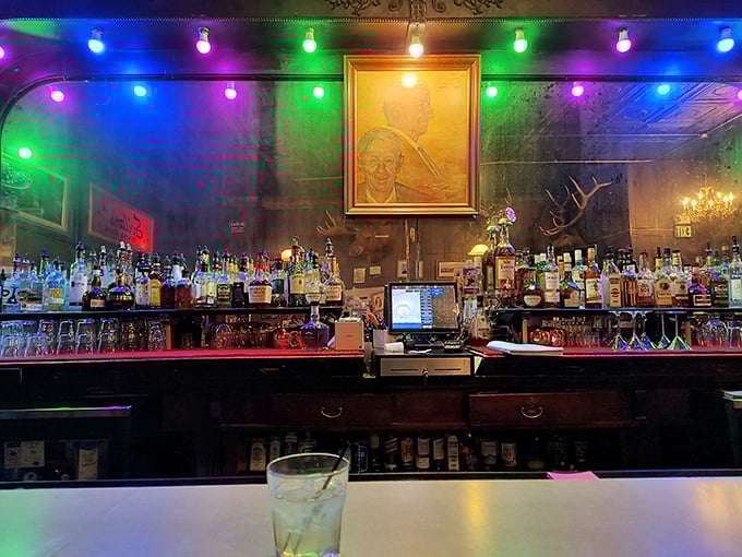 The bar glows with colorful lights and decades of stories, while bottles stand at attention, ready to facilitate your evening's memories.