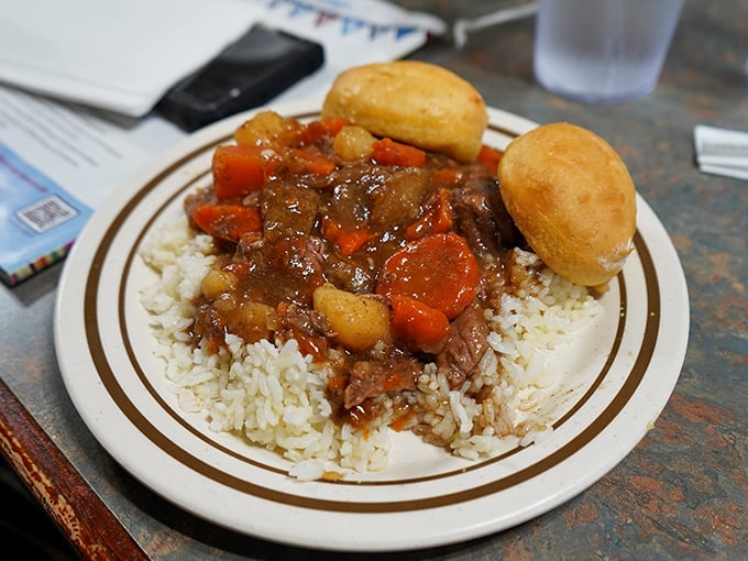 Beef stew over rice with pillowy rolls &ndash; the kind of meal that makes you want to hug the chef.