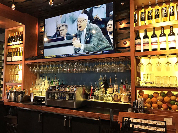 The well-stocked bar promises liquid accompaniments for every palate&mdash;from amber whiskeys to crisp wines, all backlit for maximum temptation.