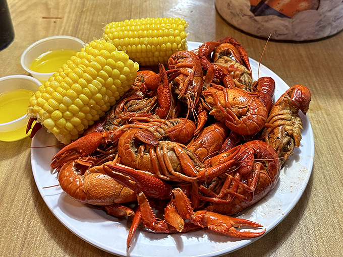 Crawfish and corn—a plate that practically shouts "roll up your sleeves and prepare for delicious manual labor!"