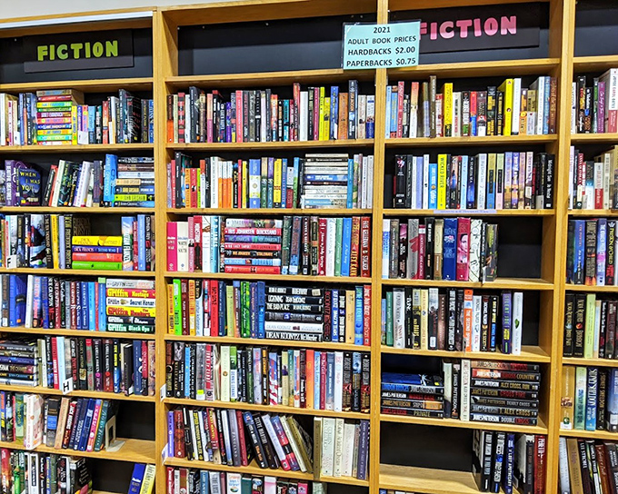 Fiction shelves packed tighter than a bestseller's plot twists&mdash;each book waiting for its next chapter with a new owner.