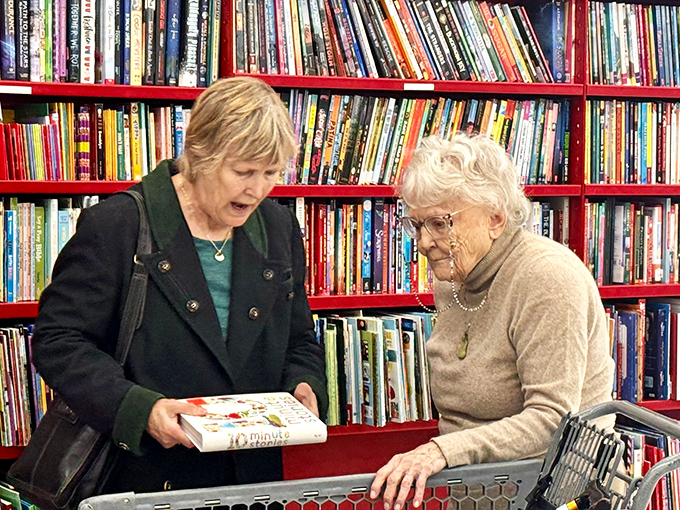 Book browsers in their natural habitat, discovering that the joy of finding a perfect read is matched only by paying a fraction of retail price.