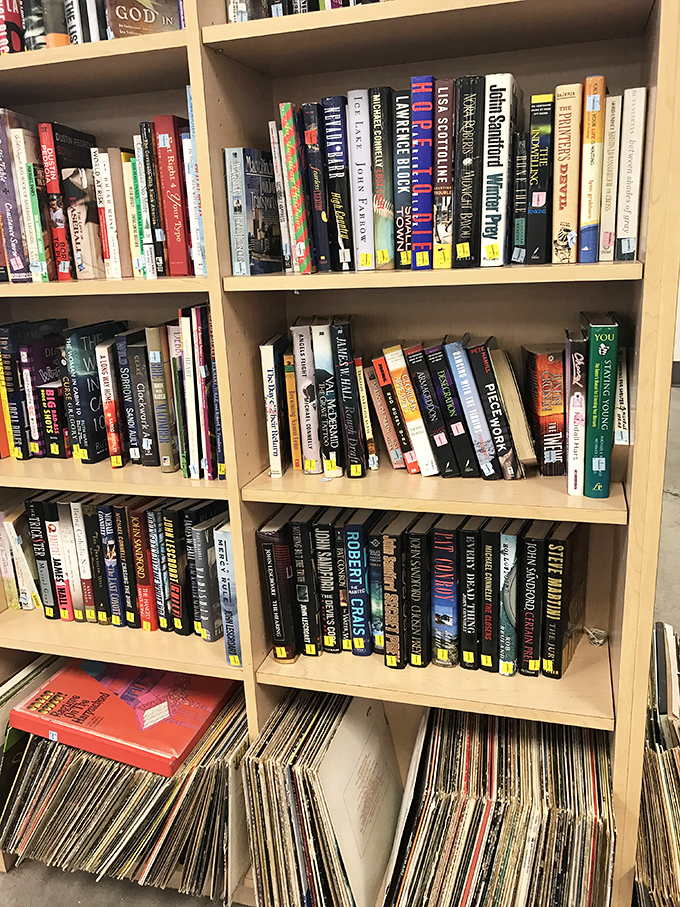 Literary treasure trove where bestsellers mingle with obscure gems. Below, vinyl records promise analog adventures in a digital world. 