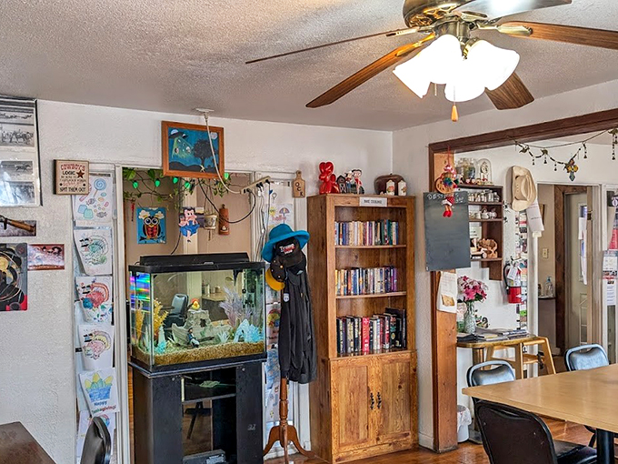 Every great local eatery needs a touch of whimsy – like this fish tank and bookshelf corner that says, "Stay awhile, we're in no hurry."