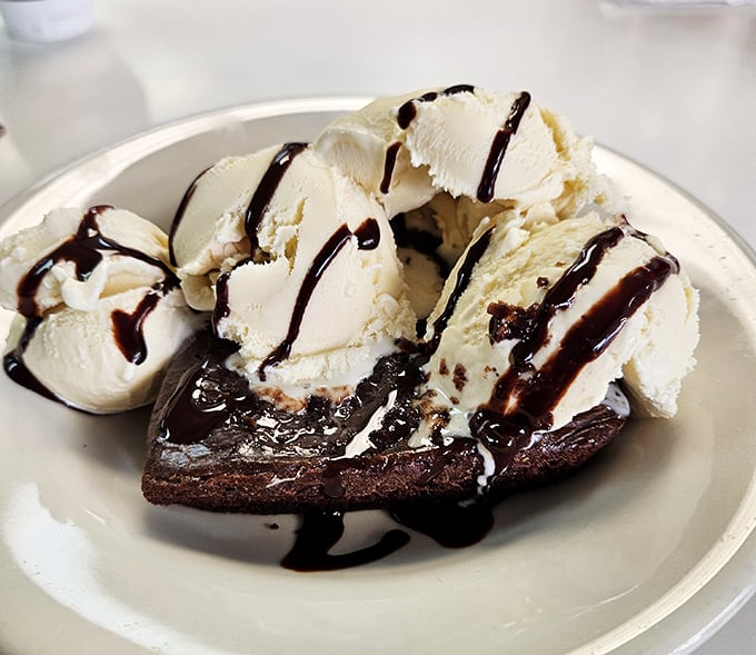 Some desserts whisper sophistication. This brownie sundae bellows satisfaction. Ice cream melting into warm chocolate is nature's perfect partnership.
