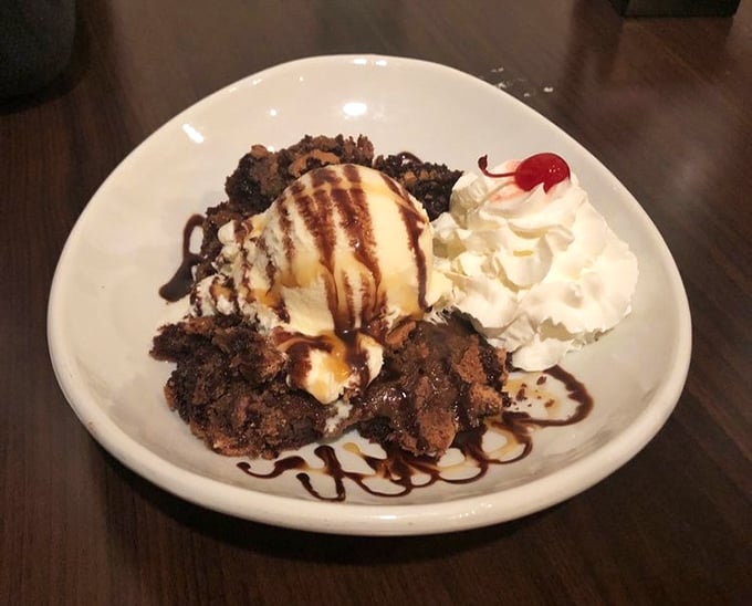 A brownie sundae that understands the importance of balance: warm and cold, chewy and creamy, chocolate intensity softened by vanilla's gentle touch.