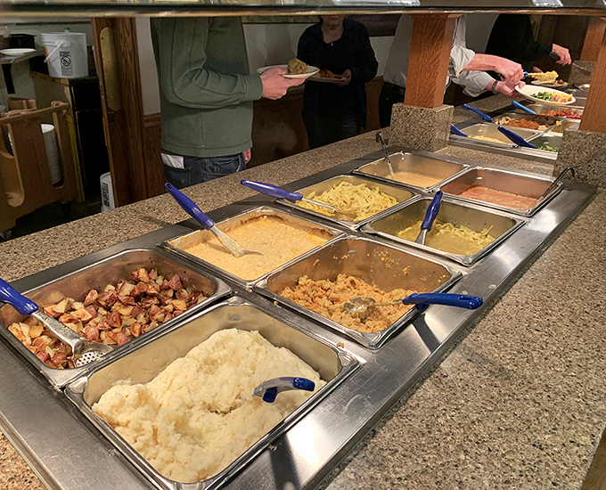 The buffet line of dreams. Each steam tray holds another reason to loosen your belt and whisper "just a little more" to the server.