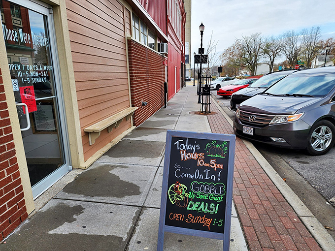 The sidewalk sign invites passersby to "gobble up some great deals." In the antique world, today's hours are just a suggestion for how long you'll stay.