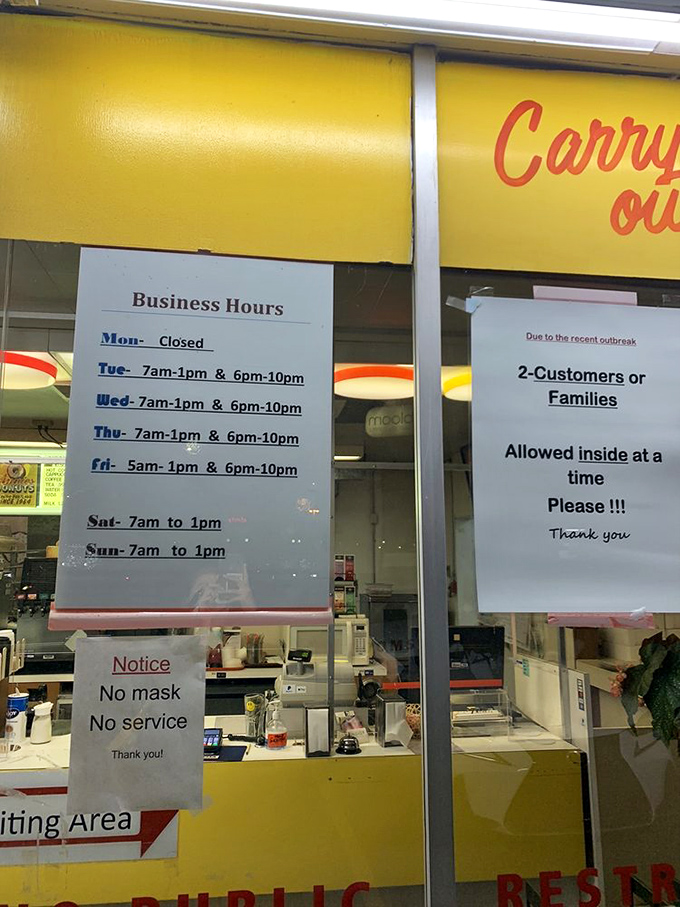 The hours posted like sacred text. Note them carefully, for arriving outside these times leads to the special kind of heartbreak only donut-lovers understand.