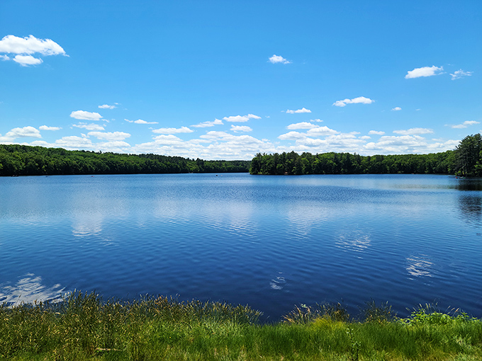 The reservoir's mirror-like surface reflects clouds with such precision you might momentarily forget which way is up&mdash;nature's ultimate optical illusion.