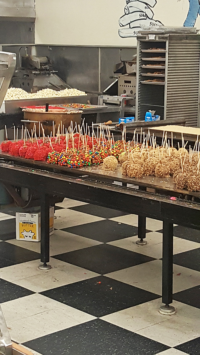 Candy apples lined up like sugary soldiers – proof that fruit can indeed be improved upon when dipped in hot sugar and dressed in sprinkles.