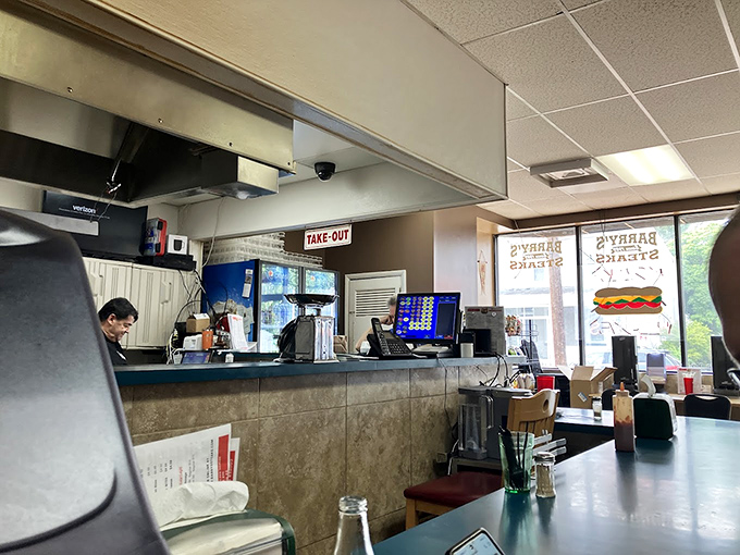 Where the magic happens—the counter where dreams are ordered and fulfilled. That "TAKE OUT" sign might as well say "HAPPINESS HERE."