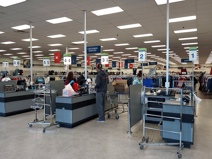 Where retail therapy meets efficiency&mdash;numbered checkout lanes keep the treasure flow moving as shoppers exit with their newfound bounty.