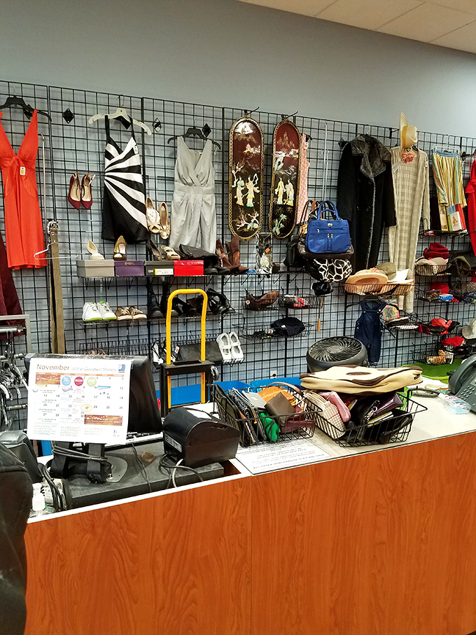 The checkout counter's display wall showcases the cream of the donation crop, where higher-end finds get special treatment before finding new homes.