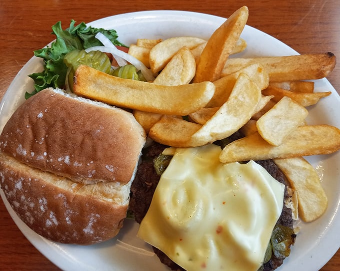 A proper diner cheeseburger with hand-cut fries &ndash; no pretentious aioli or artisanal nonsense, just honest-to-goodness American satisfaction.