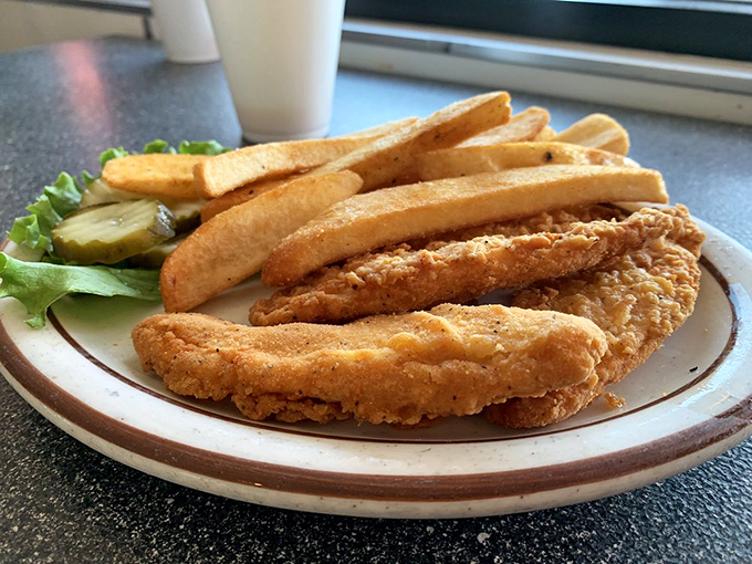 These chicken strips aren't just fried &ndash; they're transformed into golden-brown wands of crispy magic that make adults forget they ever outgrew the kids' menu.
