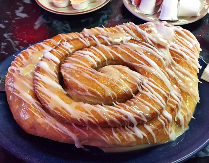 Not just a cinnamon roll&mdash;it's a spiral-shaped declaration of joy. The icing doesn't drizzle, it celebrates.