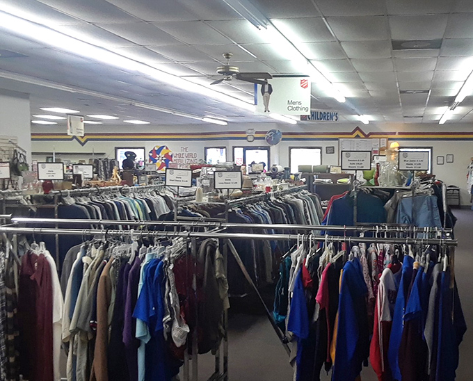 Racks on racks on racks. Each hanger holds potential—a new favorite shirt, a vintage gem, or tomorrow's perfect outfit.