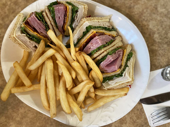 The club sandwich&mdash;that multi-story mansion of lunch architecture where turkey, ham, and bacon live in delicious harmony with crispy fries.
