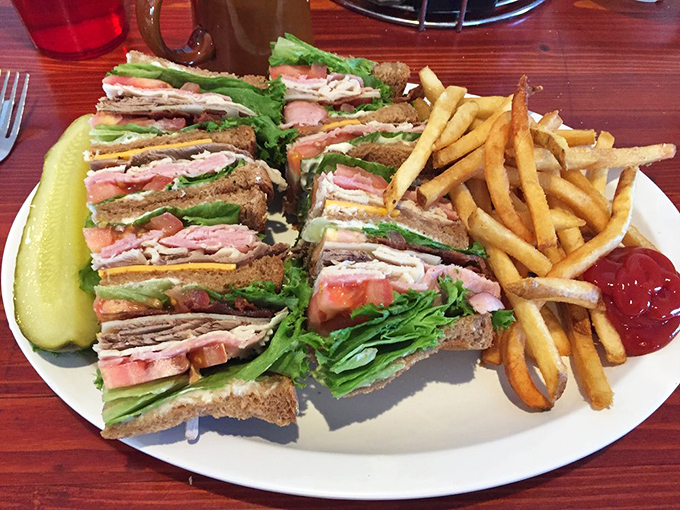 This club sandwich stands taller than some Arizona mountains, layered with precision that would make an architect jealous.