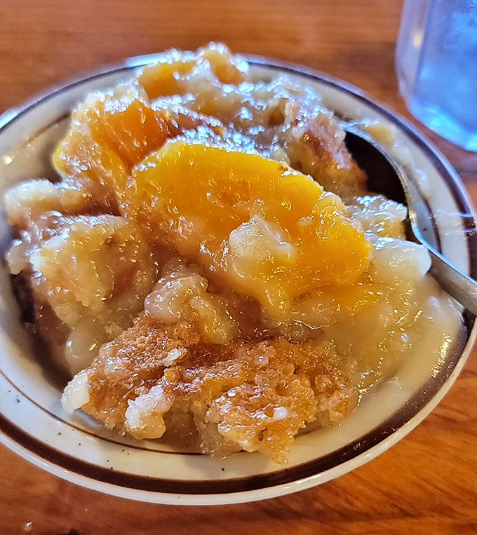 Peach cobbler that captures summer in a bowl &ndash; warm, sweet, and just like grandma's, if grandma had a secret deal with the peach gods. Photo