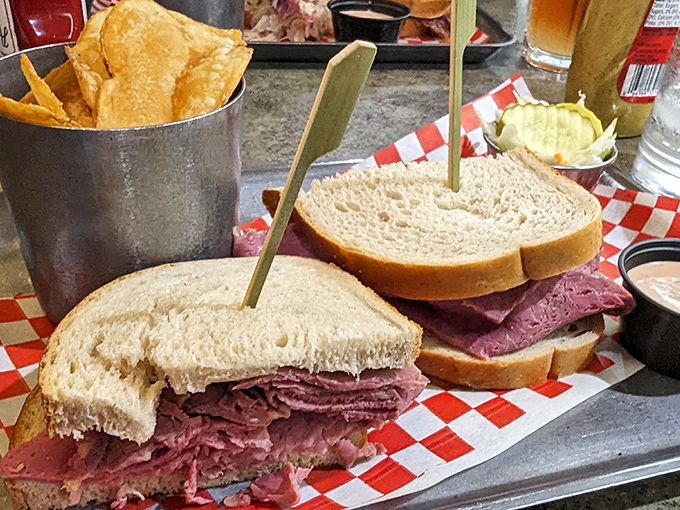 A proper deli sandwich that requires jaw exercises before attempting. The corned beef is stacked higher than Manhattan rent prices.