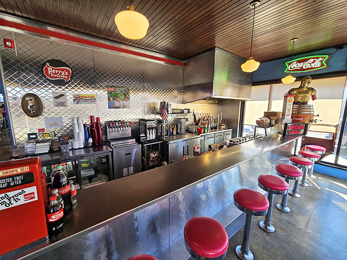 The counter where magic happens&mdash;red stools lined up like patient soldiers waiting for hungry patrons to claim their front-row seats.
