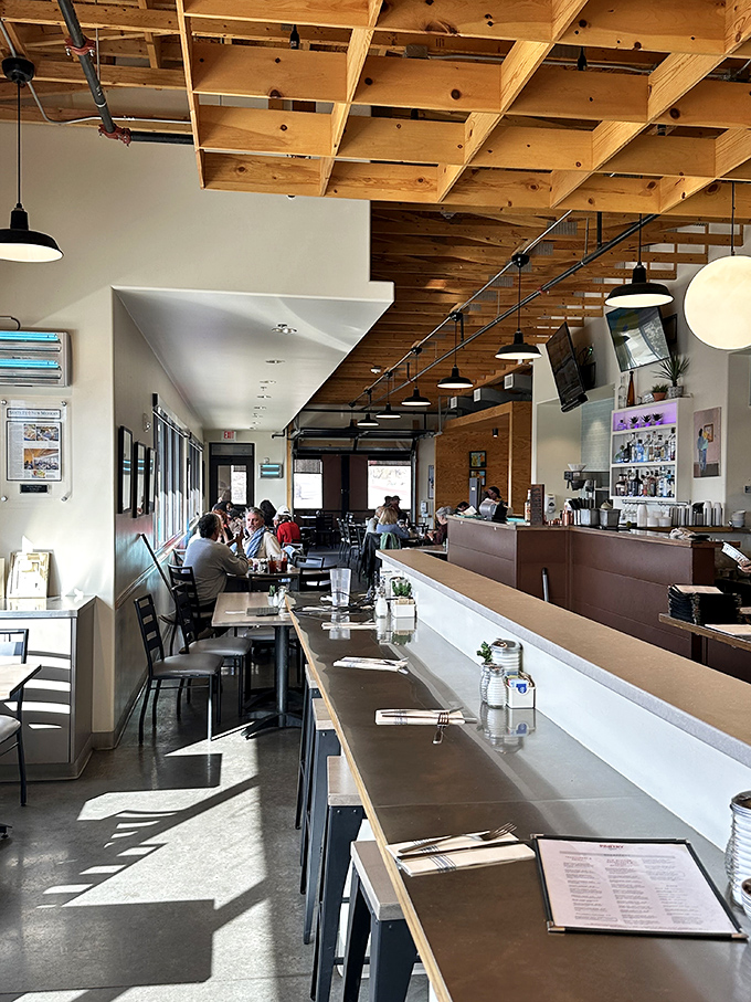 Morning light streams through windows onto wooden tables where coffee cups steam and breakfast dreams come true. This is where Santa Fe starts its day. 