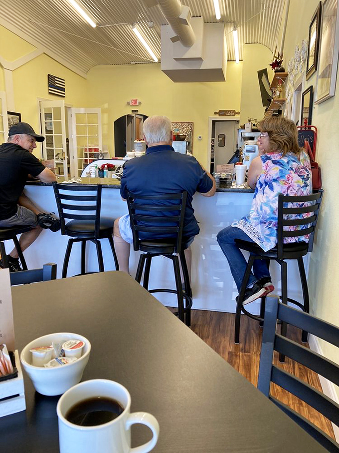 Counter seating: where regulars perch with coffee, watching the breakfast ballet unfold while trading stories and local gossip.