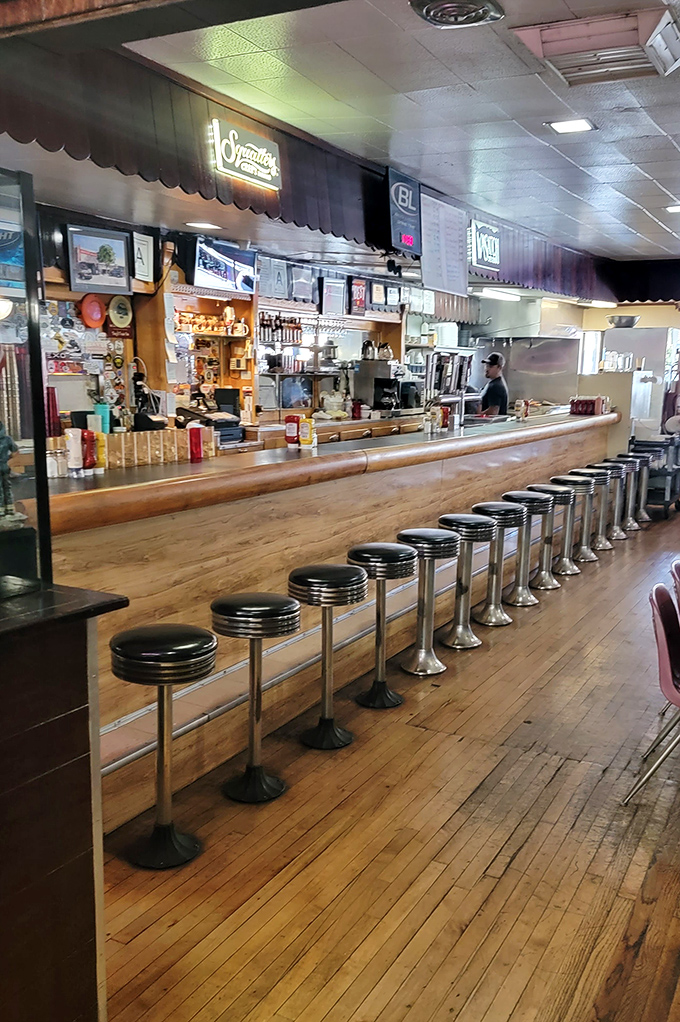 The counter at Ray's isn't just seating &ndash; it's front-row tickets to culinary theater where burgers are the headlining act.