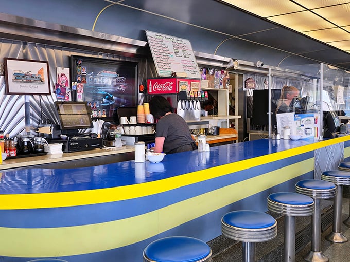 The counter: where solo diners become temporary family and the coffee keeps flowing like conversation between old friends.
