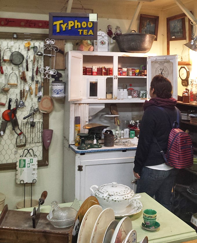Vintage kitchen cabinets and Typhoo Tea signs transport browsers back to grandma's kitchen, where everything somehow tasted better than it does today.