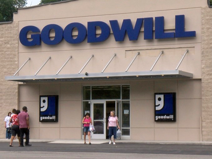Happy shoppers exit with bags in hand, their faces bearing the unmistakable glow of thrift store victory.