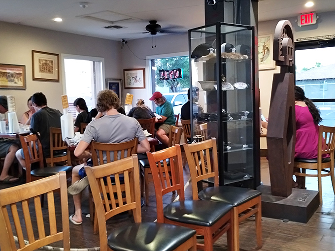 Diners of all backgrounds gather around these tables, united by the universal language of "this tastes amazing."