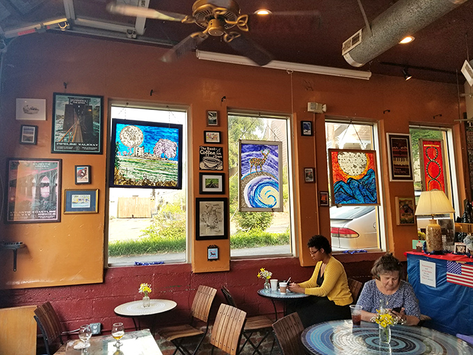 Stained glass windows filter light onto diners lost in conversation&mdash;proving that sometimes the best social media is actually just being social over media-worthy food.